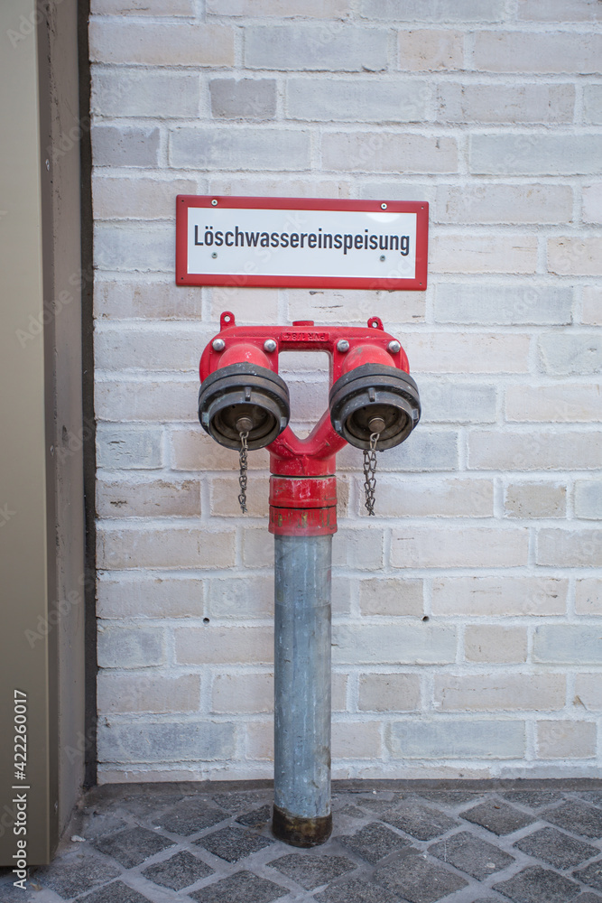 Fire water supply with two outlets is located at a building. Stock ...