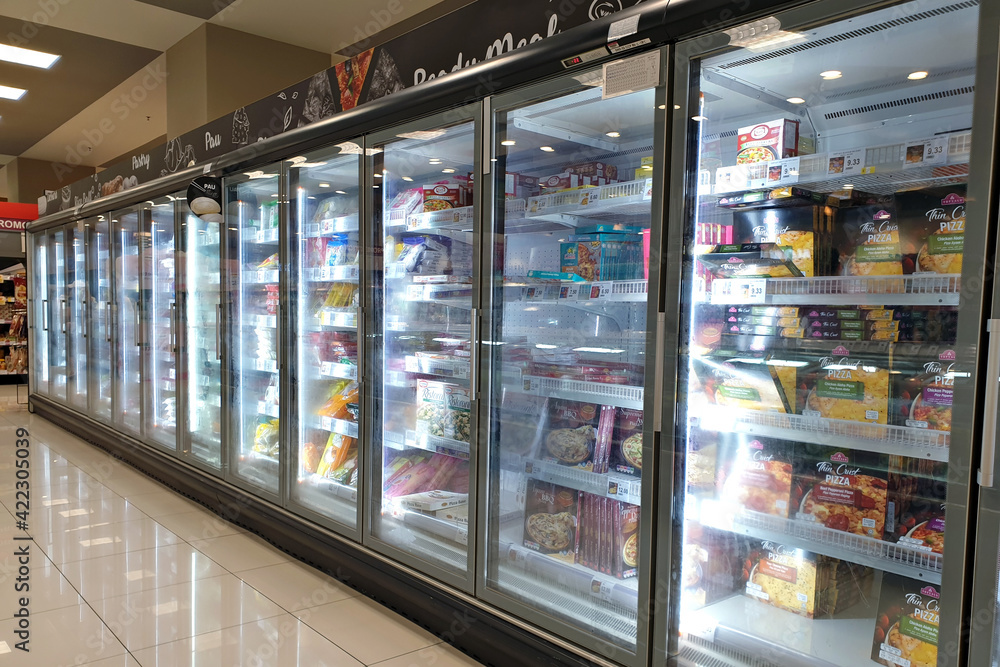 Interior view of the huge fridge with various brand frozen food in Aeon ...