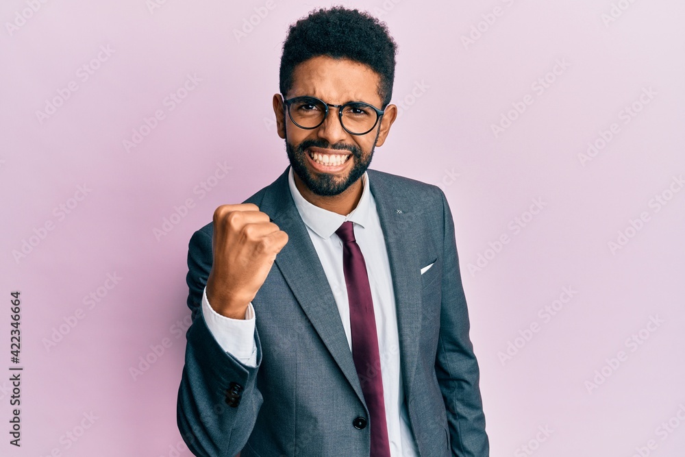Handsome hispanic business man with beard wearing business suit and tie ...