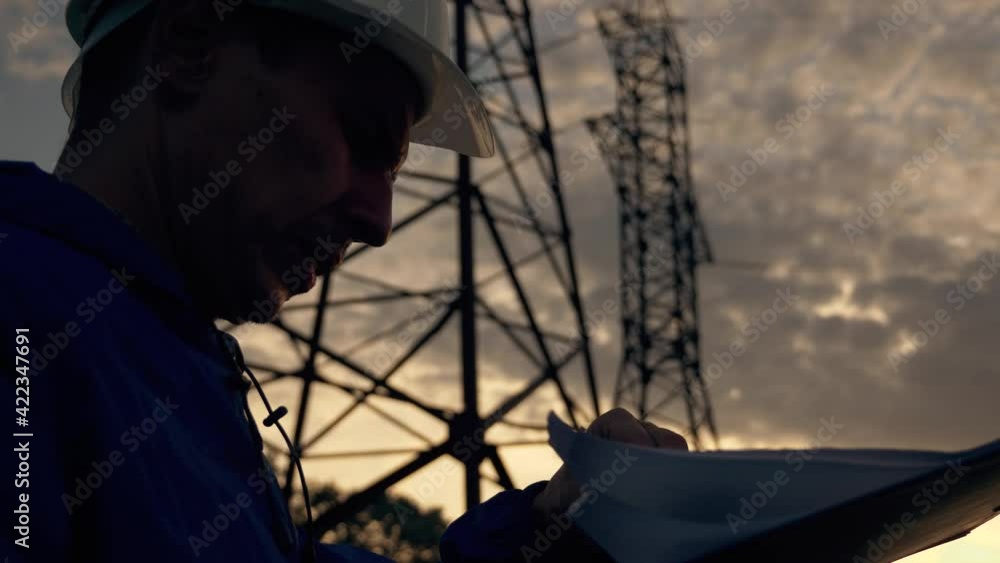 Electric energy concept, technology. engineer works with energy project ...