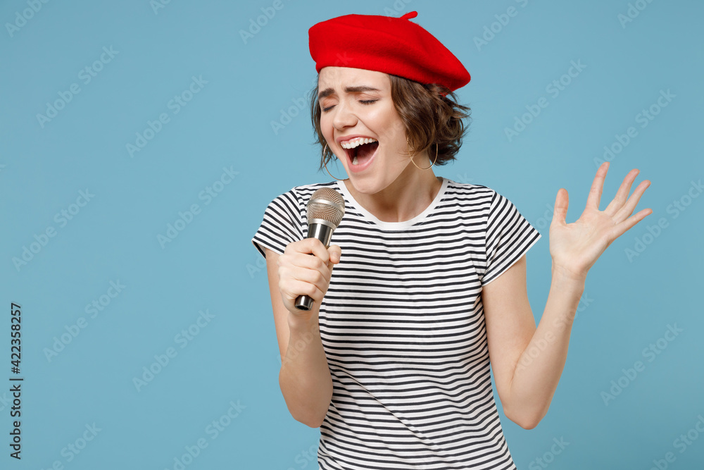 Young singer woman 20s with short hairdo wearing french beret red hat ...