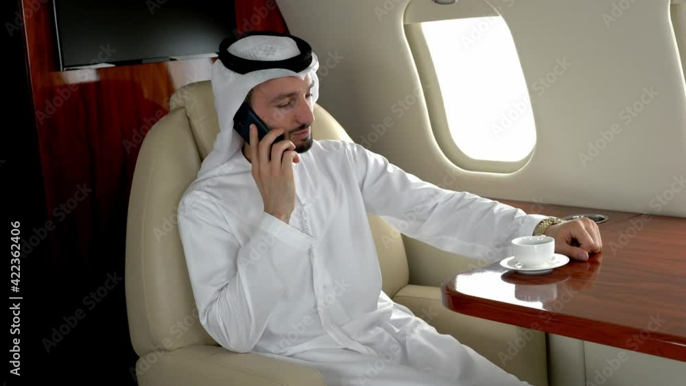 Arabian man flying on his Private jet to dubai. Video concept about ...