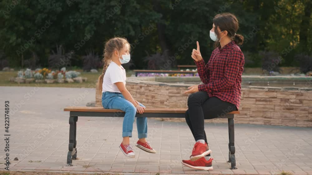 Video „Social distance, epidemic.Children park are sitting medical ...