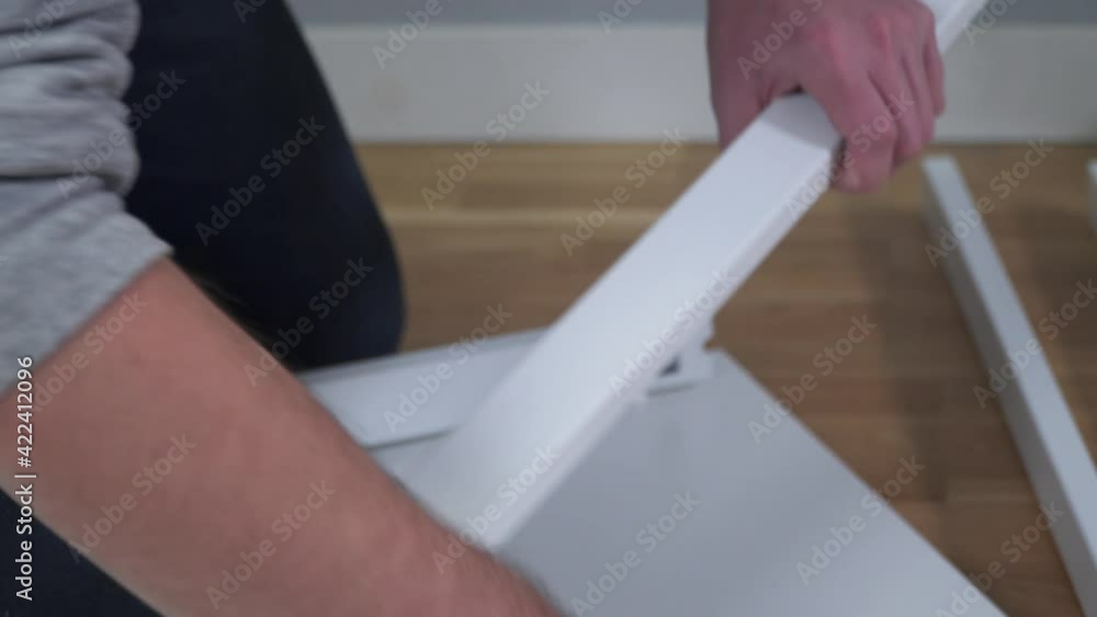 DIY white table assembly process at home. Furniture installation. New ...