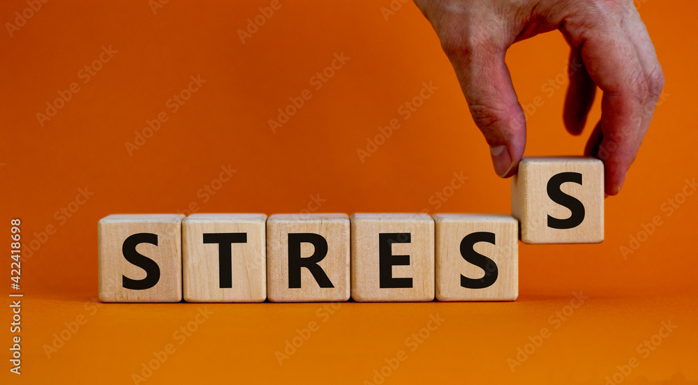 Stop stress and be health symbol. Doctor holds cubes with the word ...