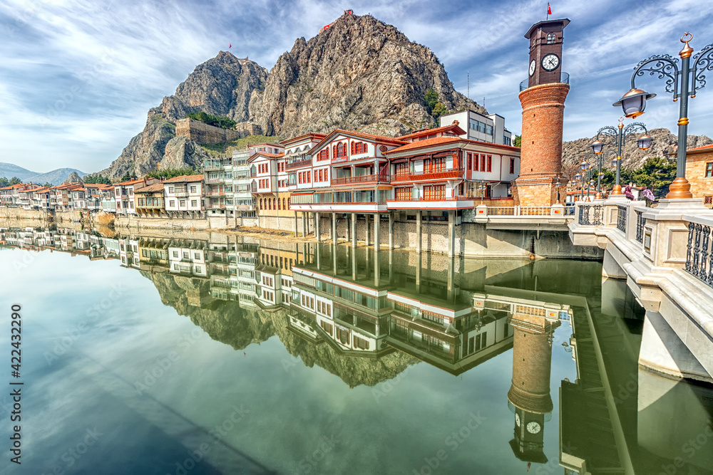 Landscape of historical houses, clock tower and Green River (Turkish ...