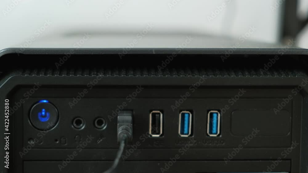 Video Stock Close-up footage on front shows USB cable plugged into port ...