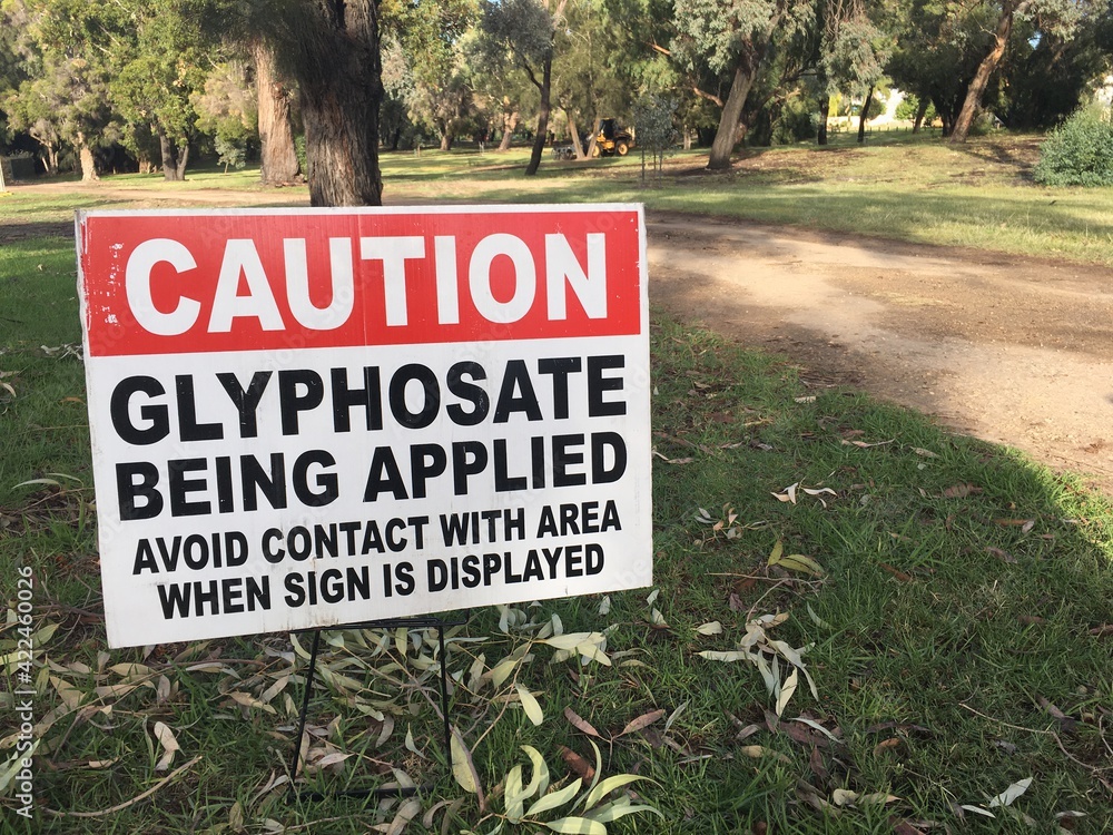Cation Glyphosate being applied. Outdoor sign on city park path Stock ...