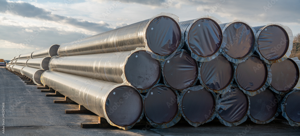 A stack of pipes on the construction site of a gas pipeline that will ...