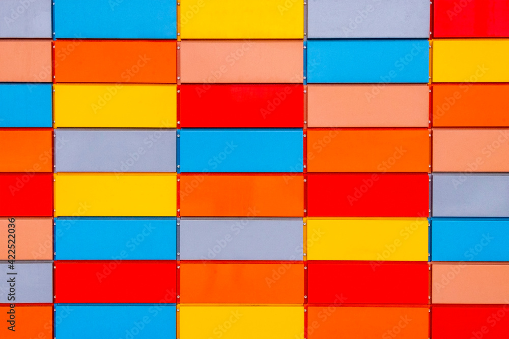 Multi-colored metal ventilated facade of the building. Background from ...