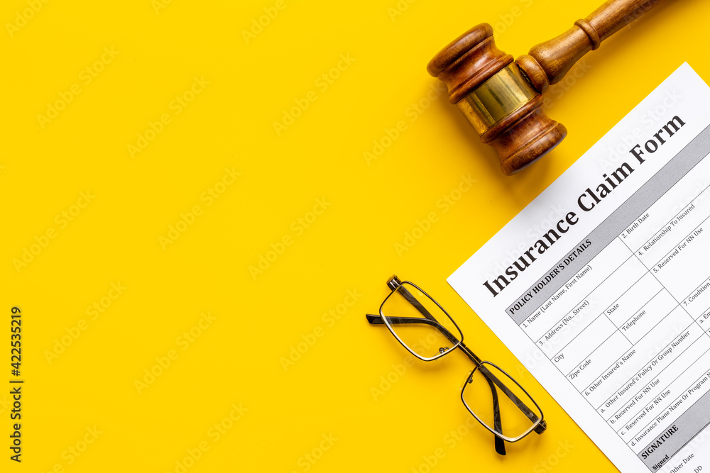 Insurance claim form with judge gavel . Top view Stock Photo | Adobe Stock