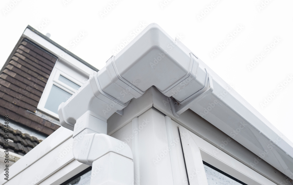 Cleaned white plastic pvc gutters and drain pipes that were blocked and ...