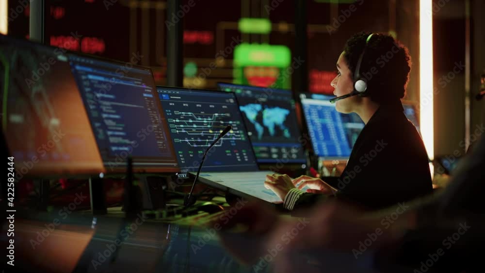 Multiethnic Female IT Technical Support Specialist Talking with a ...