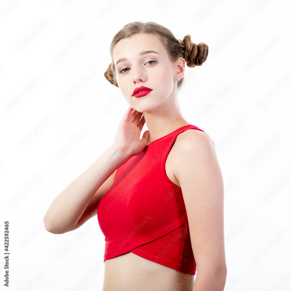 Young charming woman wearing red top posing at studio over white ...