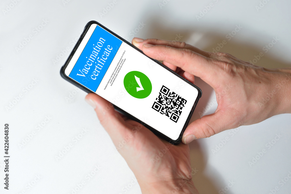 Smartphone displaying a valid digital vaccination certificate passport ...