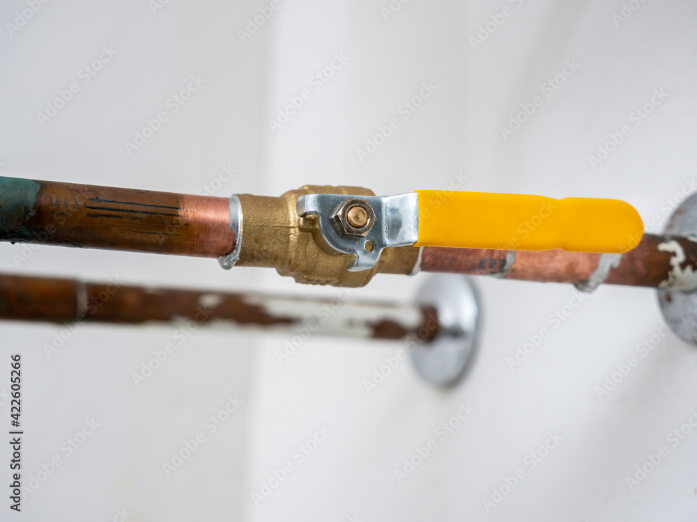 Water shut off valve. Copper plumbing pipe with brass water supply ...