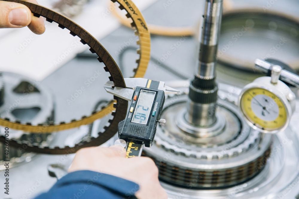 Set of various engine and gearbox spare parts. Shiny gears for ...