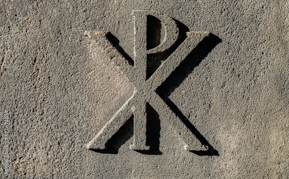 XP - sign, symbol of christianity - chrism. jesus christ. on gray stone ...