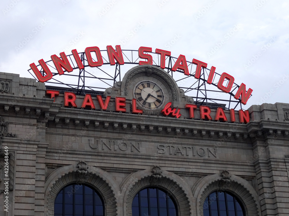 Union Station Sign Travel by Train sign and clock on top of building ...