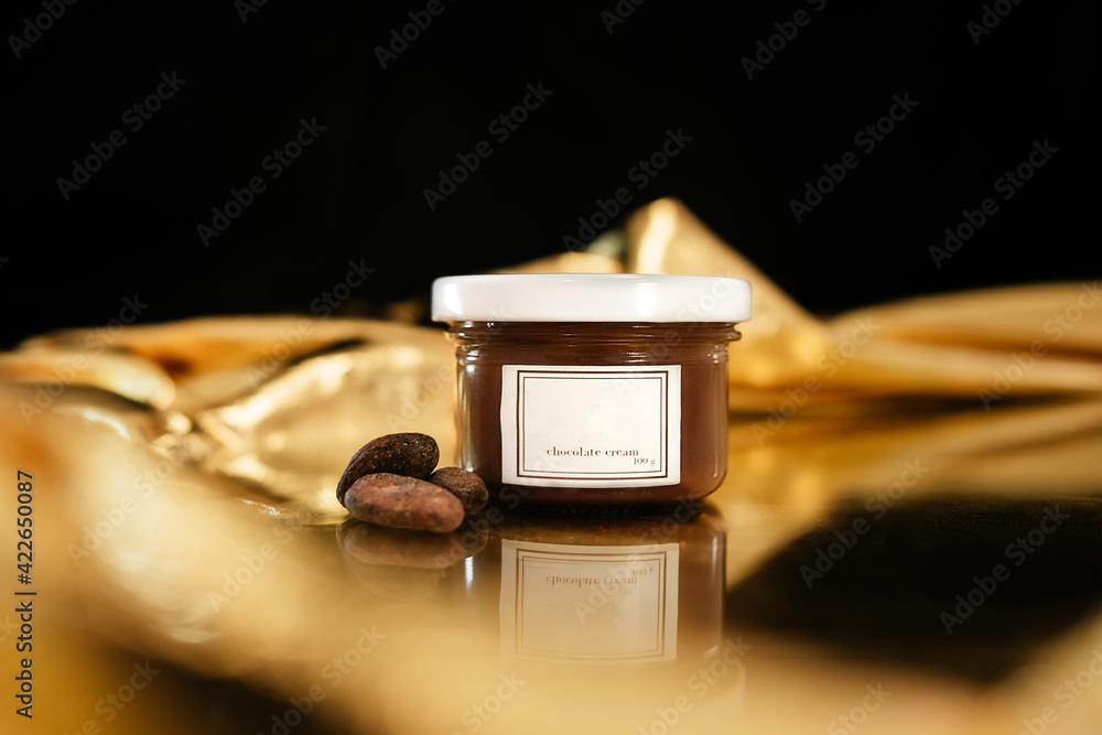jar of chocolate paste on a gold background ,mock up Stock Photo ...