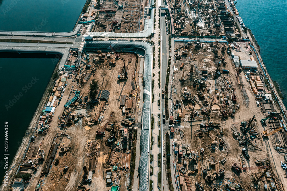 Top view at large construction sites and many cranes are working in the ...