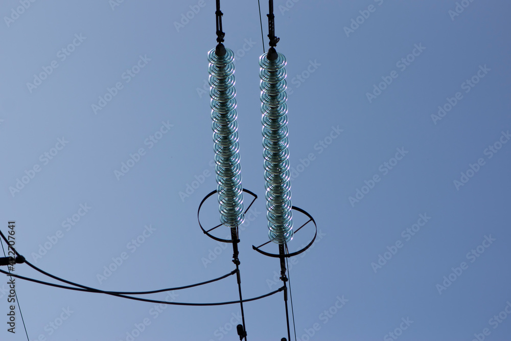 power line of cables and insulators close up. electrical insulators ...