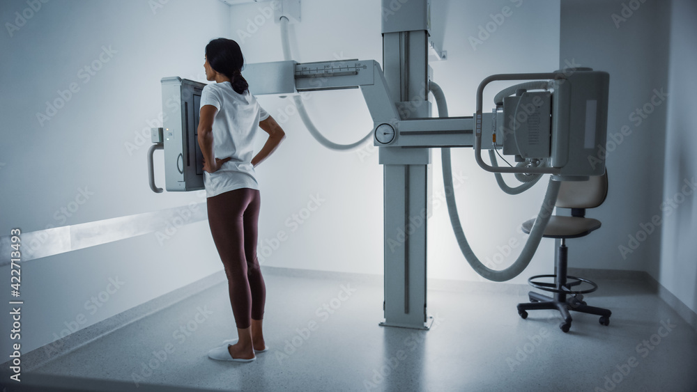 Hospital Radiology Room: Beautiful Multiethnic Woman Standing in the X ...