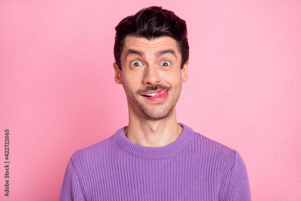 Portrait of attractive cheerful hilarious guy licking lip having fun ...