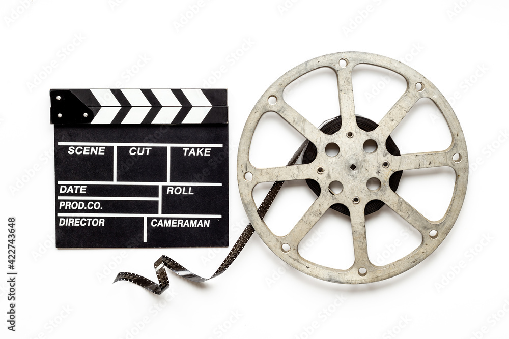 Movie film reel with clapperboard. Cinema concept Stock Photo | Adobe Stock