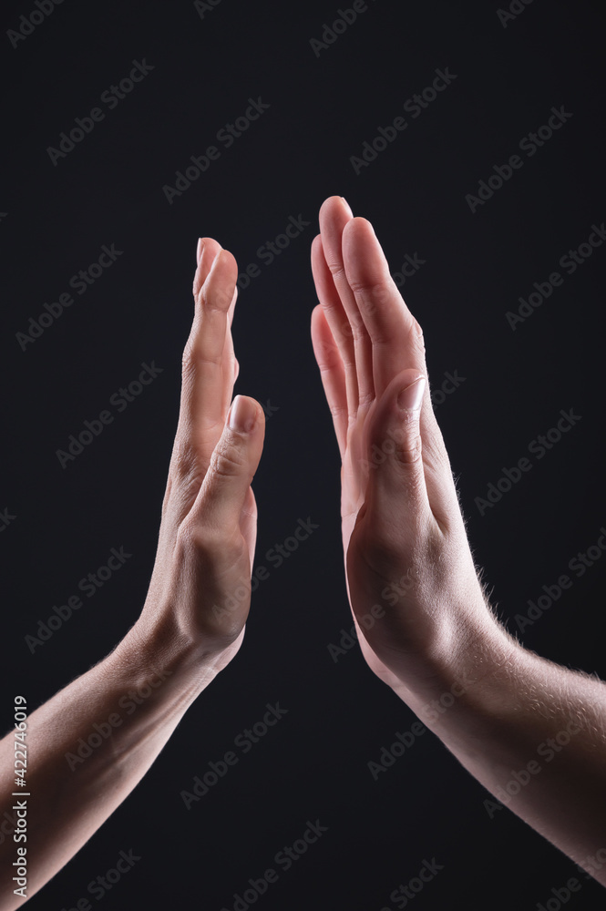 Two hands do not touch each other close up. The concept of neatness and ...