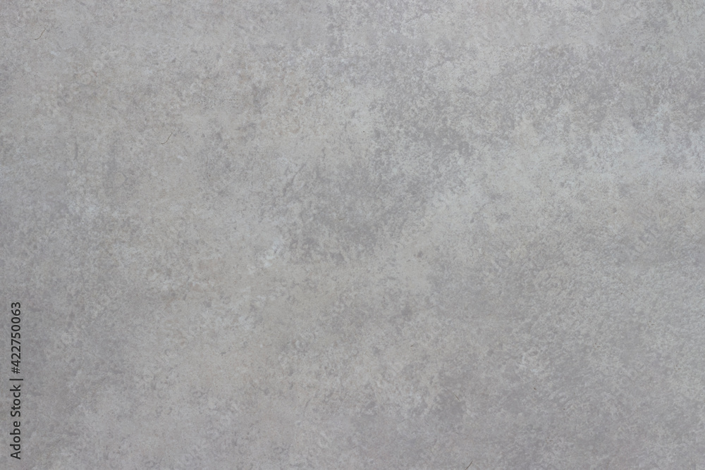 The texture of the floor tiles with a light pattern that mimics a ...