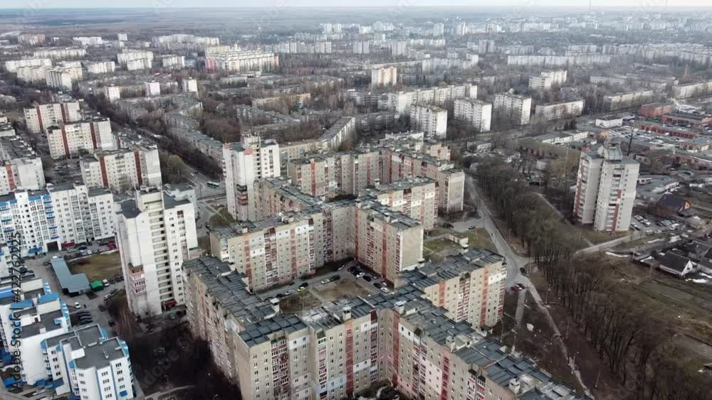 The drone flies over the cityscape. Roofs of Soviet panel houses ...