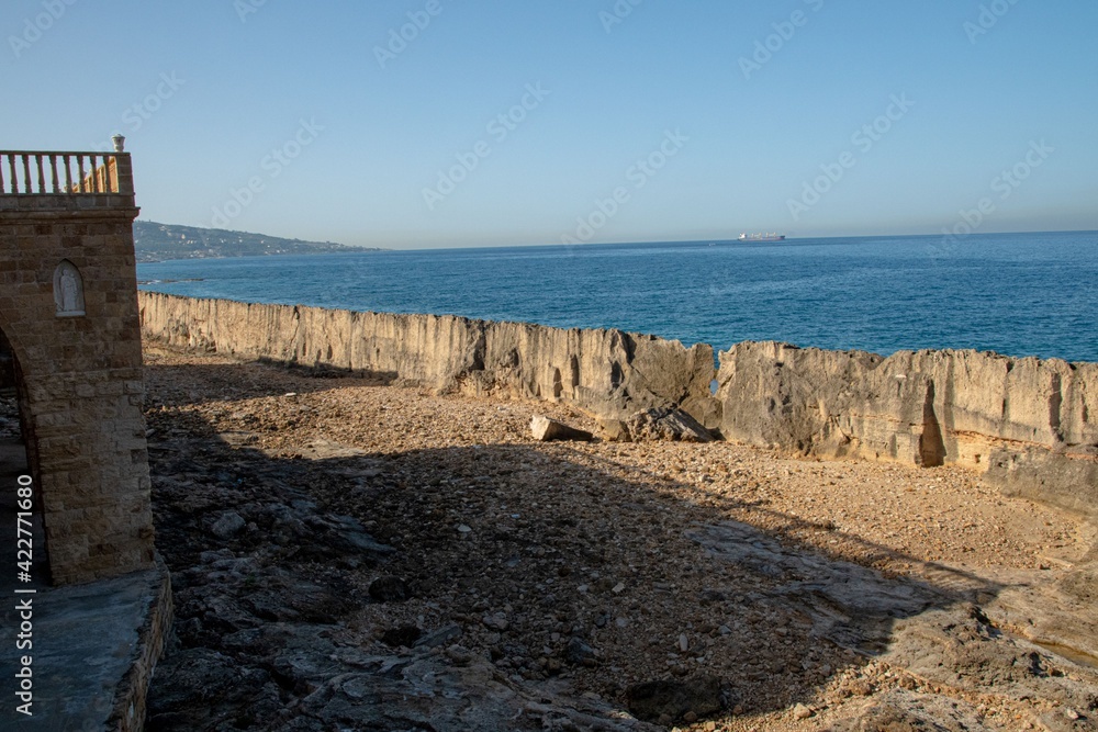 antique Phoenician wall at the Lebanese coastal town of Batroun, famous ...