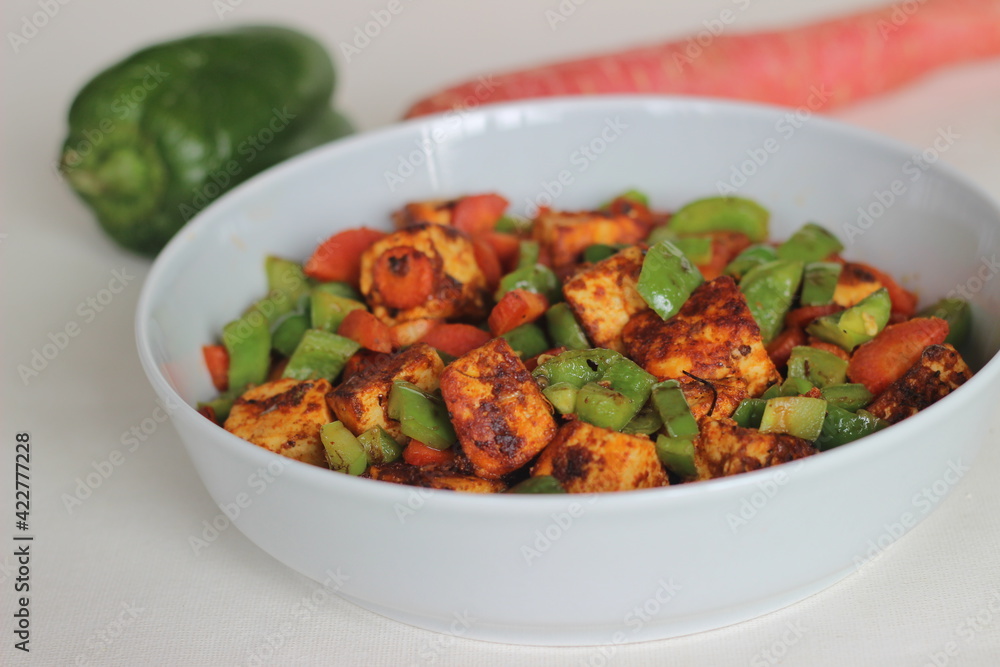 Tawa roasted paneer with sauteed carrots and capsicum. Stock Photo ...