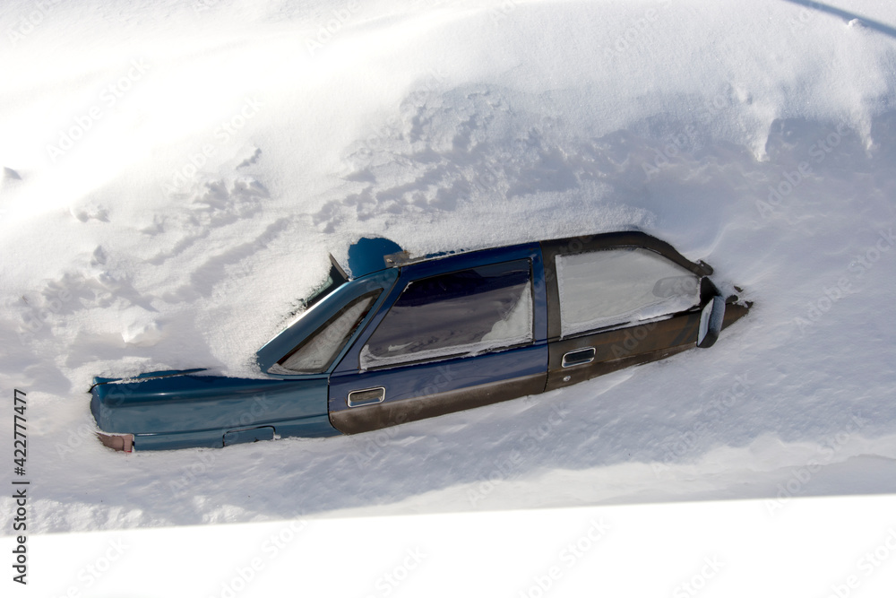 Car in the snow top view. A passenger car was covered with snow. A car ...