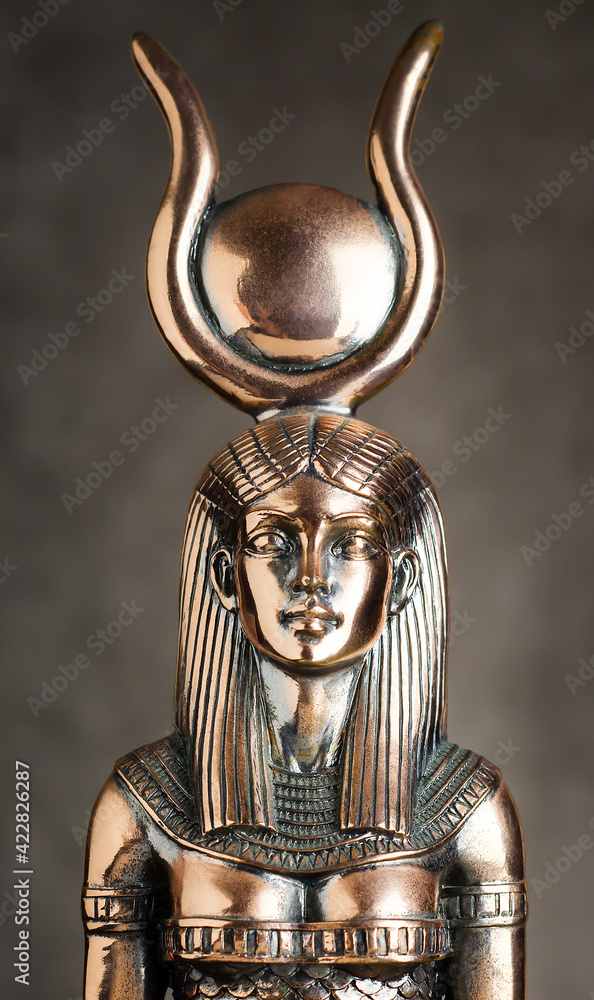 Photo & Art Print The figure of the Egyptian goddess Isis on a brown ...