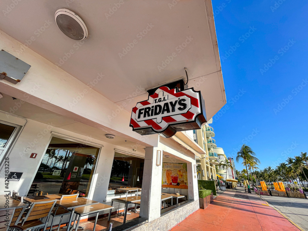 TGI Fridays sign is mounted above the entrance to the restaurant ...