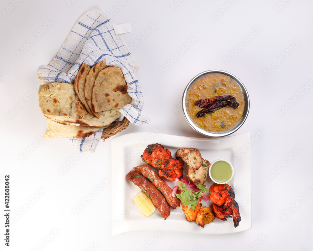 Mixed grill kebab chicken mutton beef prawn fish mint sauce lemon ...