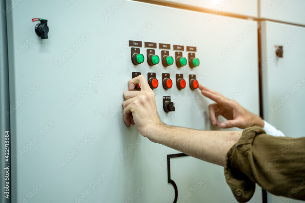 Maintenance engineers inspect relay protection system in control room ...
