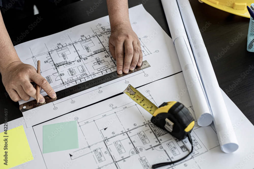 Home design architects are editing the drafts of the house plans, a ...