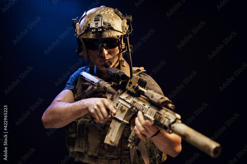 Special forces soldier with rifle on black background Stock Photo ...