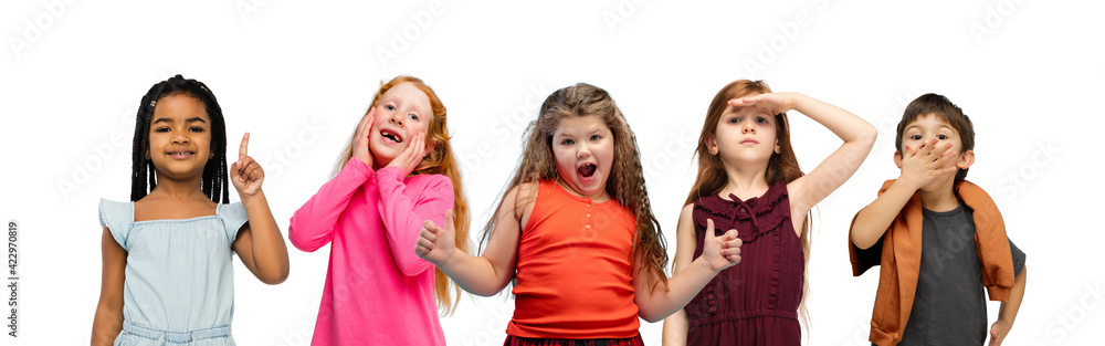 Little and happy kids gesturing isolated on white studio background ...