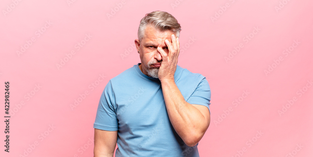 Foto de old senior man feeling bored, frustrated and sleepy after a ...