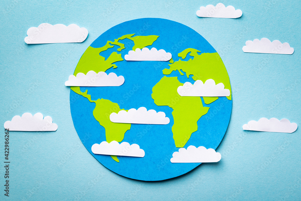 Paper cut concept of planet Earth on the blue background with paper ...
