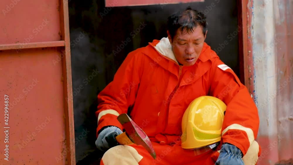 Firefighter fighting with flame using fire hose chemical water foam ...