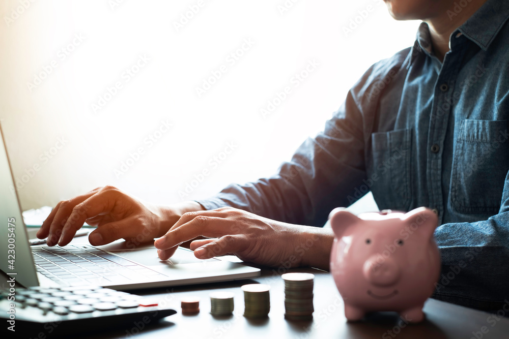 Close-up shot of man's hand using keyboard of laptop computer with ...