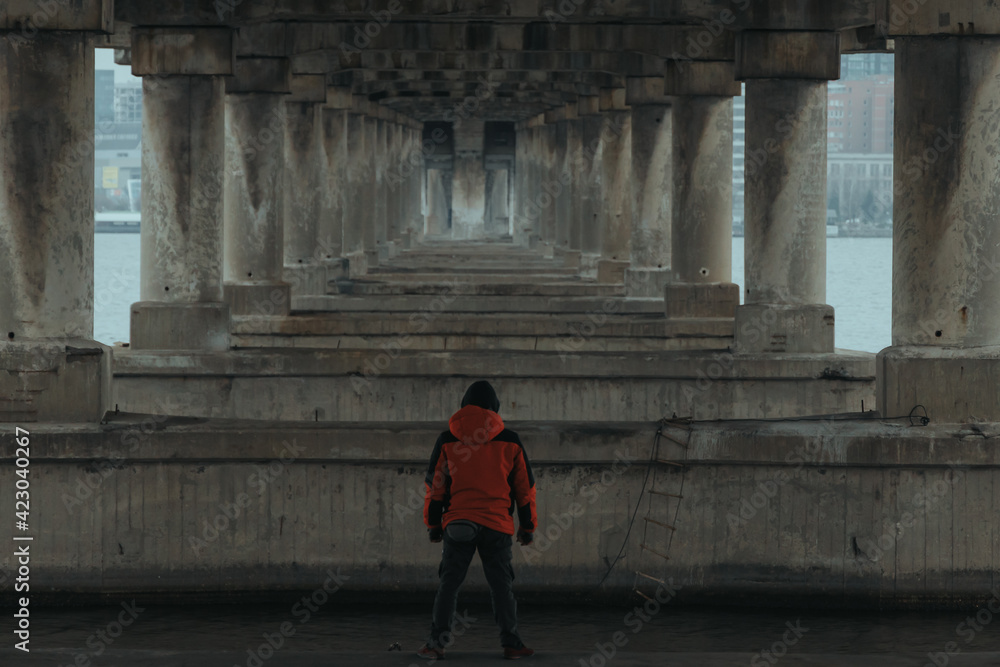 guy rufer climbed under the bridge with water. a man is photographed ...