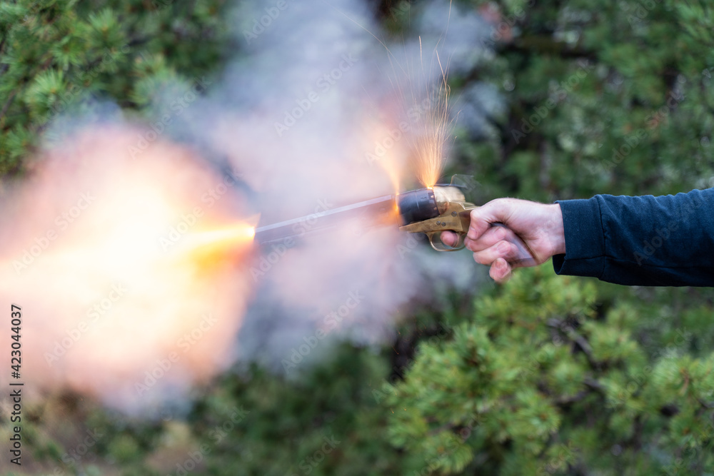 revolver pistol muzzle flash firing Stock Photo | Adobe Stock