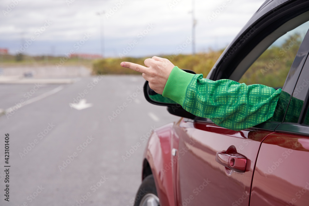 Back view of driver shows middle finger throw the windows, fuck you ...