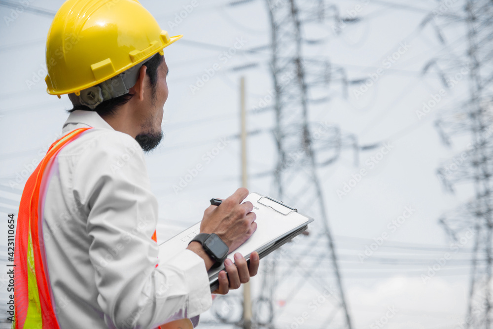 Engineer inspection high voltage tower record on check list, Engineer ...